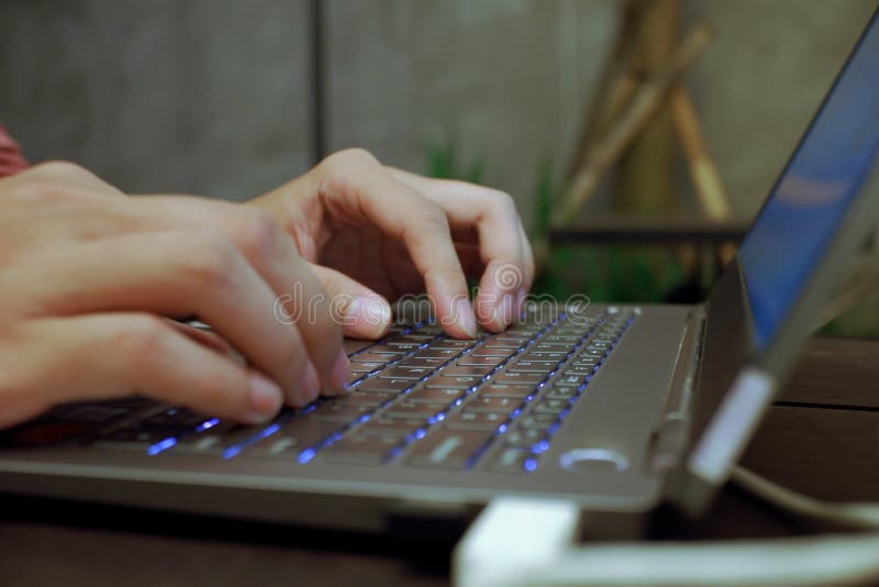 Productive Digital Workspace: Close-Up View of Hands Typing on a Laptop ...