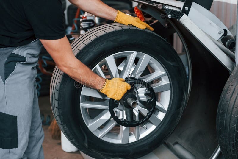 Work in Progress. Man in Uniform is in the Auto Service Stock Photo ...