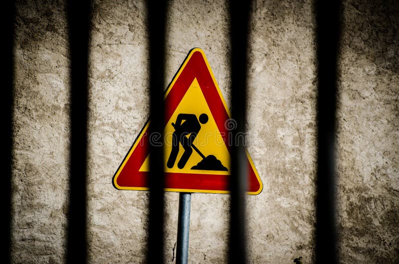 A Work in Progress Sign Behind Bars Stock Photo - Image of prisoner ...
