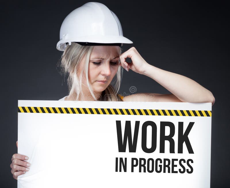 Worker Holding Work in Progress Sign on Information Board Stock ...