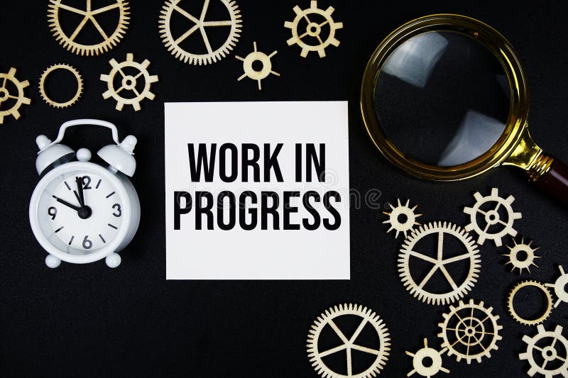 Work in Progress Text Message on Sticky Note with Magnifying Glass and ...