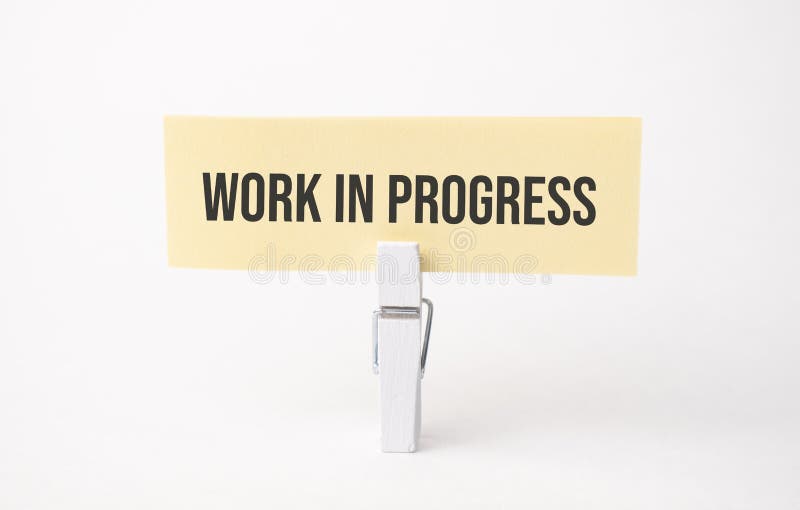 Work in Progress Word Inscription on White Card Paper Sheet in Hands of ...