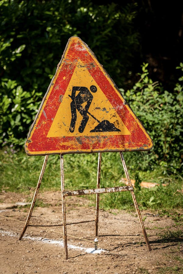 Work in Progress - Triangular Road Sign on the Roadside Stock Image ...