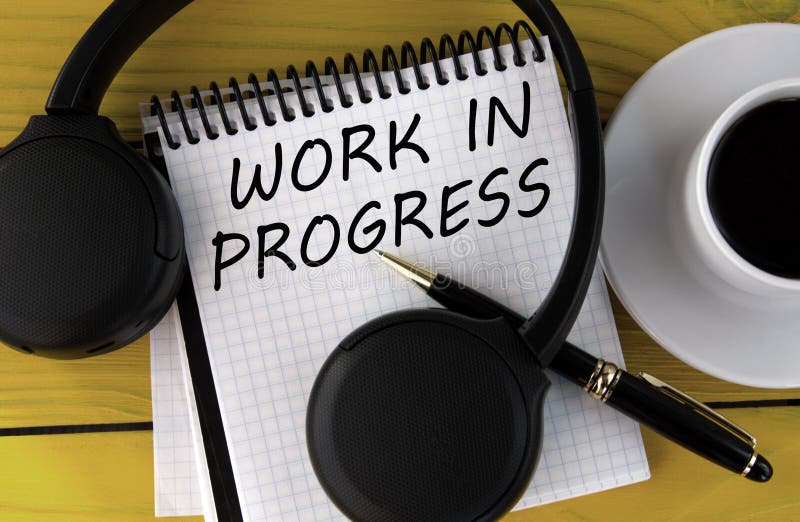 WORK in PROGRESS - Words on a White Notepad on a Yellow Background with ...