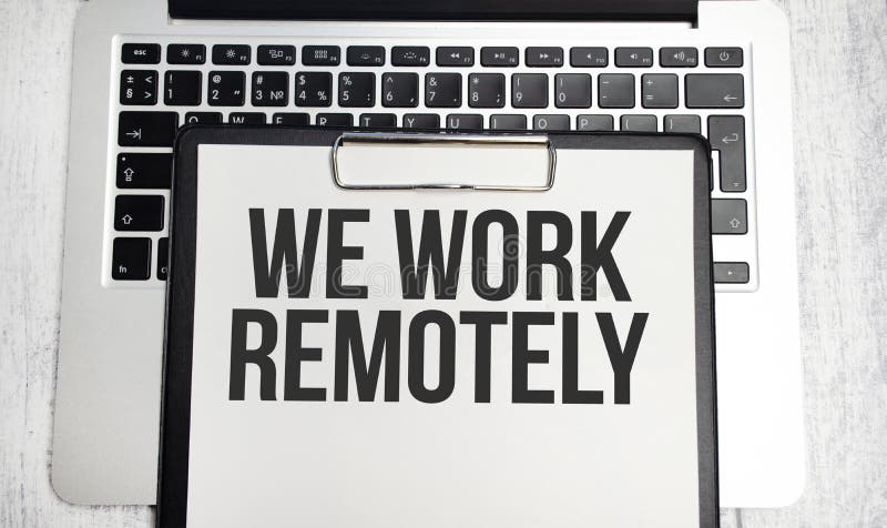 We Work Remotely Words on Paper Tablet on Laptop Stock Image - Image of ...