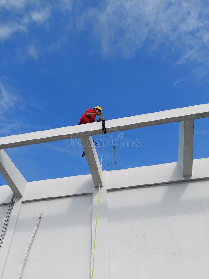 Work safety at rooftop editorial photo. Image of roof - 261664986