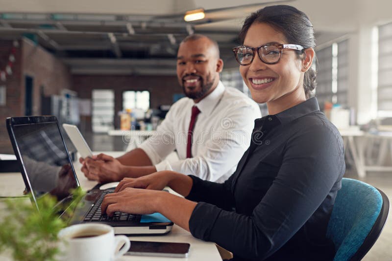 Work Smarter, Not Harder. Shot of Two Colleagues Working Together in the Office. Stock Photo ...