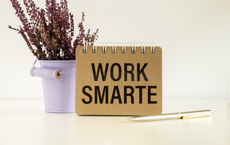 Work Smarter Text on a Notebook on White White Background , Business ...
