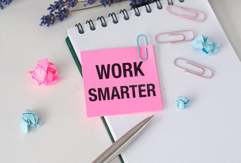 WORK SMARTER Text on a Pink Paper with Notebooks. Stock Photo - Image ...