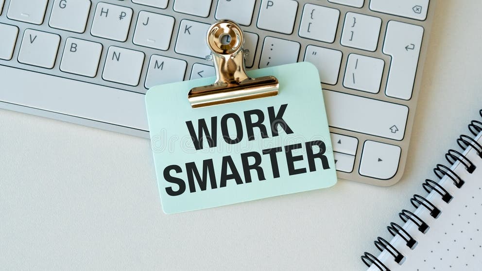 Work Smarter Text on Sticker on Keyboard with Notepad on White Table ...