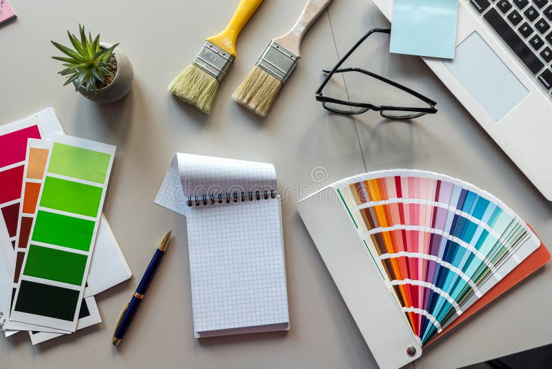 Work Space of Designer with Color Pallet, Laptop, Glasses Notepad and ...
