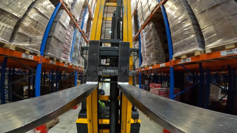 Forklift in a Modern Warehouse. Forklift in the Warehouse Concept. Work ...