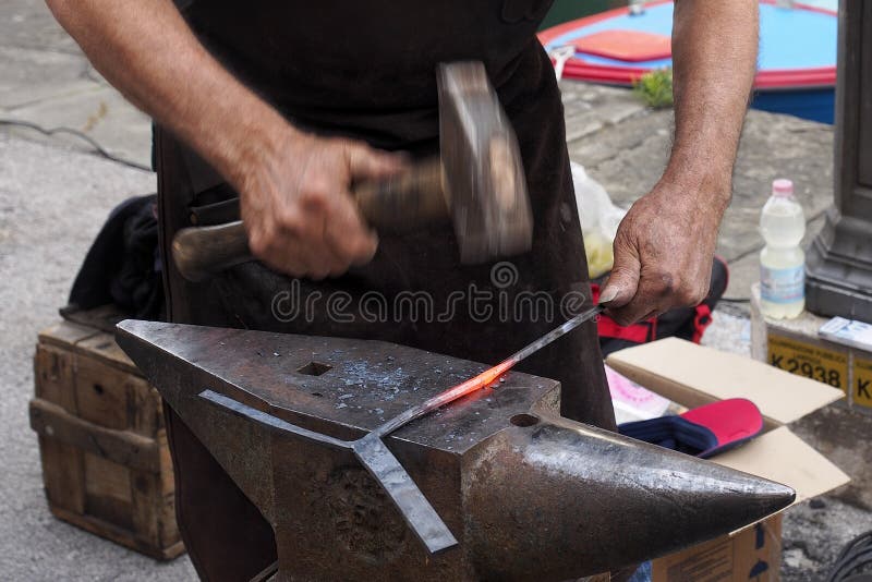 Work. Striking a Piece of Hot Iron Stock Image - Image of outdoors ...