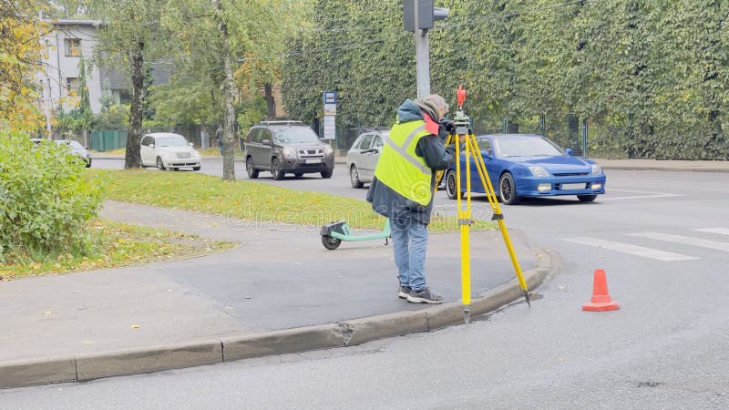 The work of a surveyor stock image. Image of vehicle - 263522987