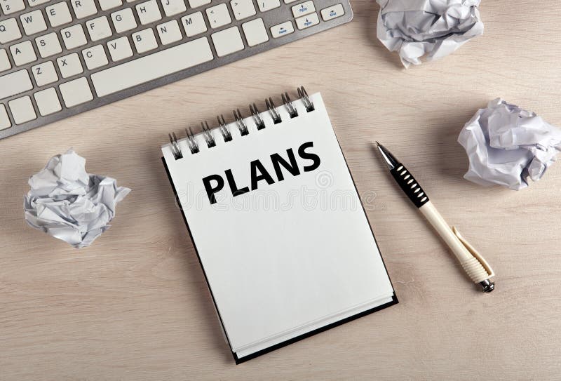 Work Table, a Notebook with Title Plans a Pen and Crumpled Paper Stock ...