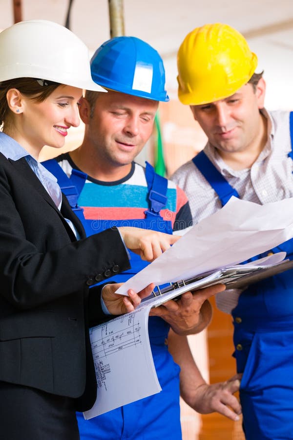 Work Team on Construction Site Controlling Floor Plan Stock Photo ...