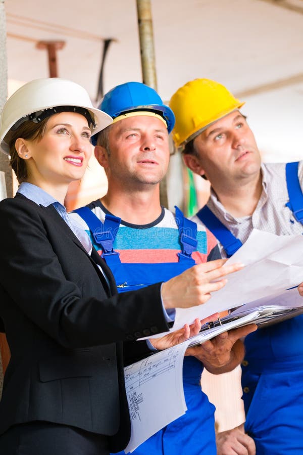 Work Team on Construction Site Controlling Floor Plan Stock Image ...