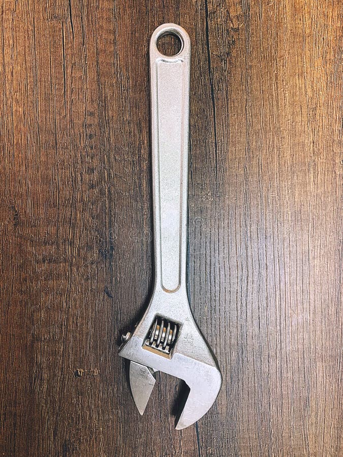 Work Tools, Adjustable Hand Wrench, on a Wooden Table Stock Photo ...