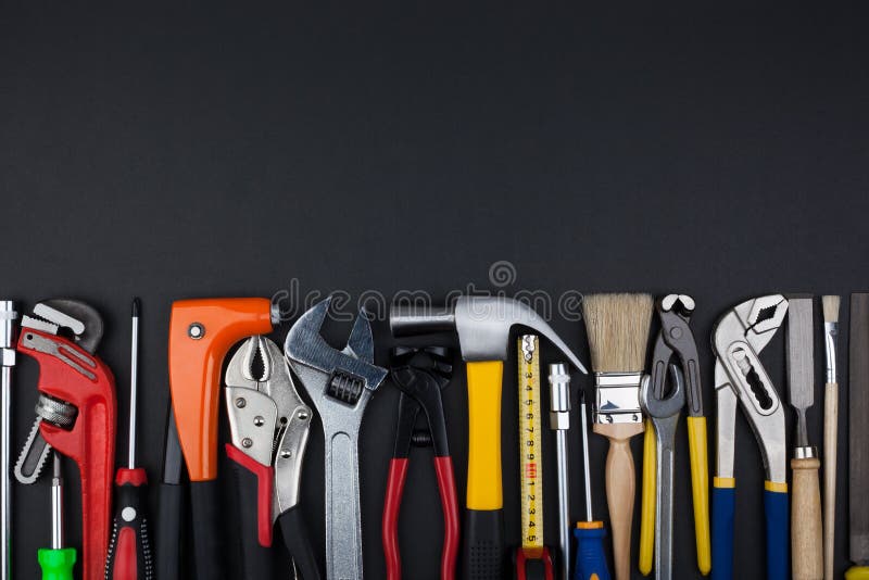 Drill, Wrench and Construction Tools on the Black Background Stock ...