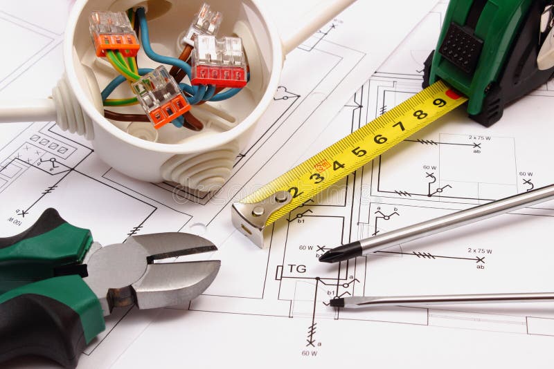 Work Tools and Electrical Box with Cables on Construction Drawing of ...