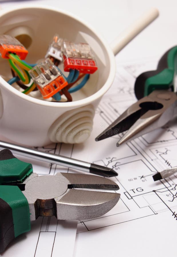 Work Tools and Electrical Box with Cables on Construction Drawing of ...