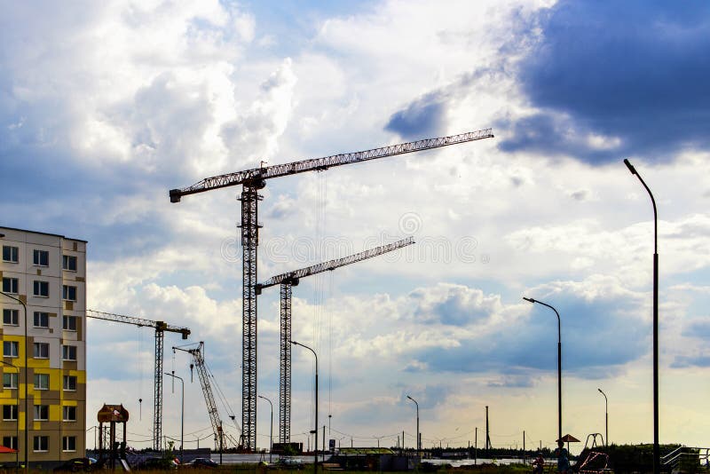 The Work of Tower Cranes Against the Background of the Sunset Sky ...