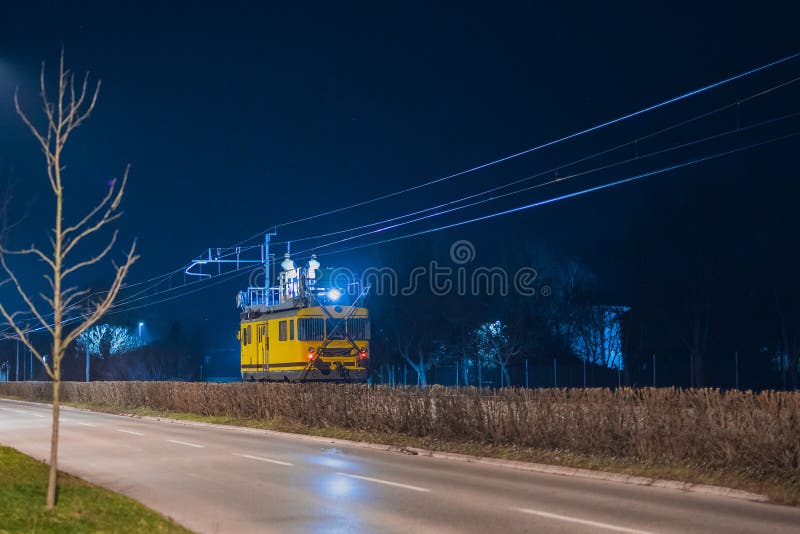 Work Train for Catenary Maintenance at Night. Workers Working at Night ...