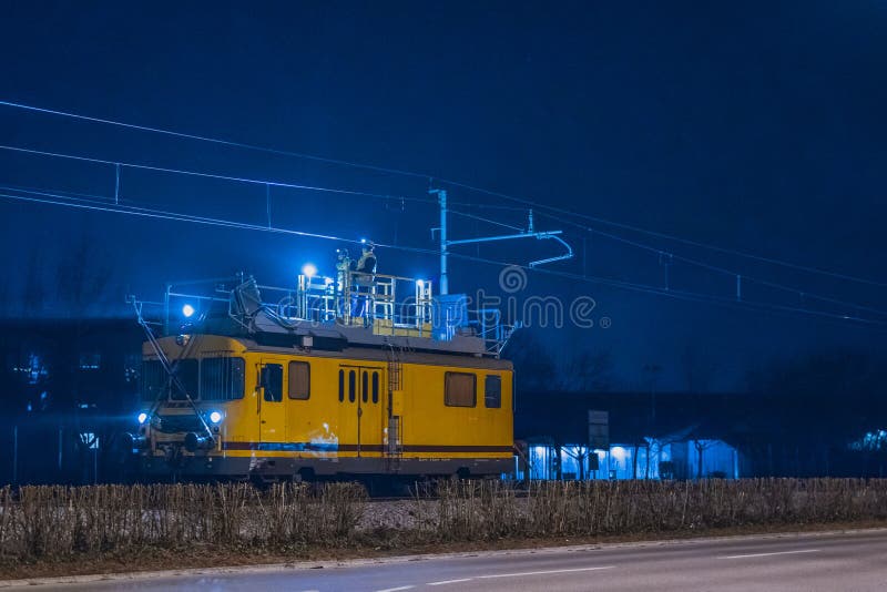 Work Train for Catenary Maintenance at Night. Workers Working at Night ...