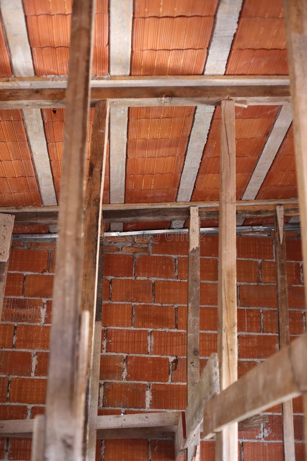 Work Under Construction. Red Ceramic Brick Roof with Supporting Wooden ...