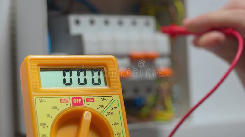 Work Under Voltage, Electrician is Checking Serviceability of Equipment ...