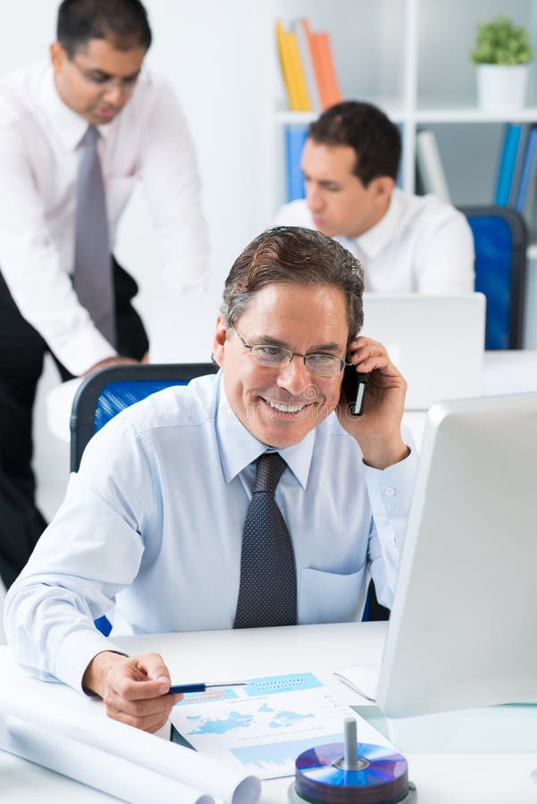 At work stock image. Image of foreground, employer, businessman - 35561179