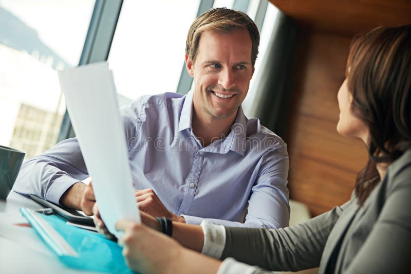 They Work so Well Together. Two Businesspeople Discussing Paperwork ...