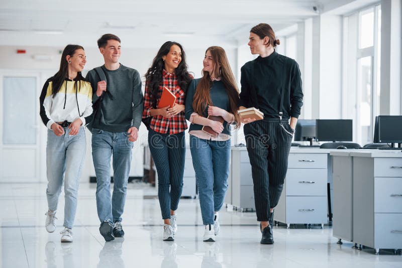 Work Will Not Wait. Group of Young People Walking in the Office at ...