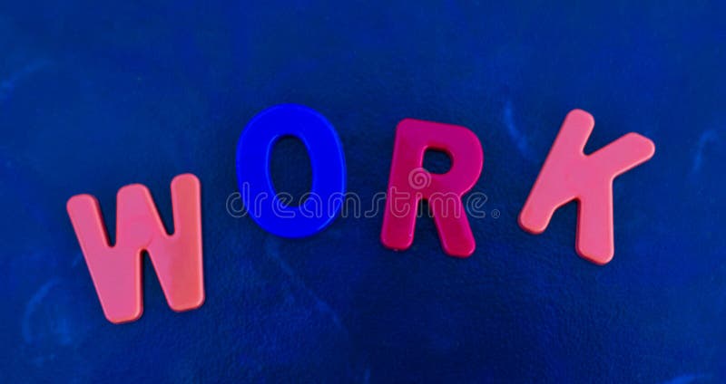 WORK - Word is Made Up of Plastic Multicolored Letters on a Blue ...