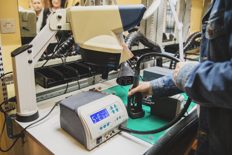 Work in the Workshop with an Electric Soldering Iron Stock Photo ...