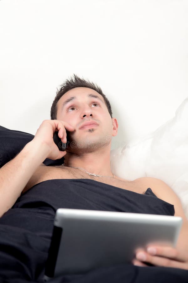 Workaholic in Bed stock image. Image of leisure, loving - 33560783