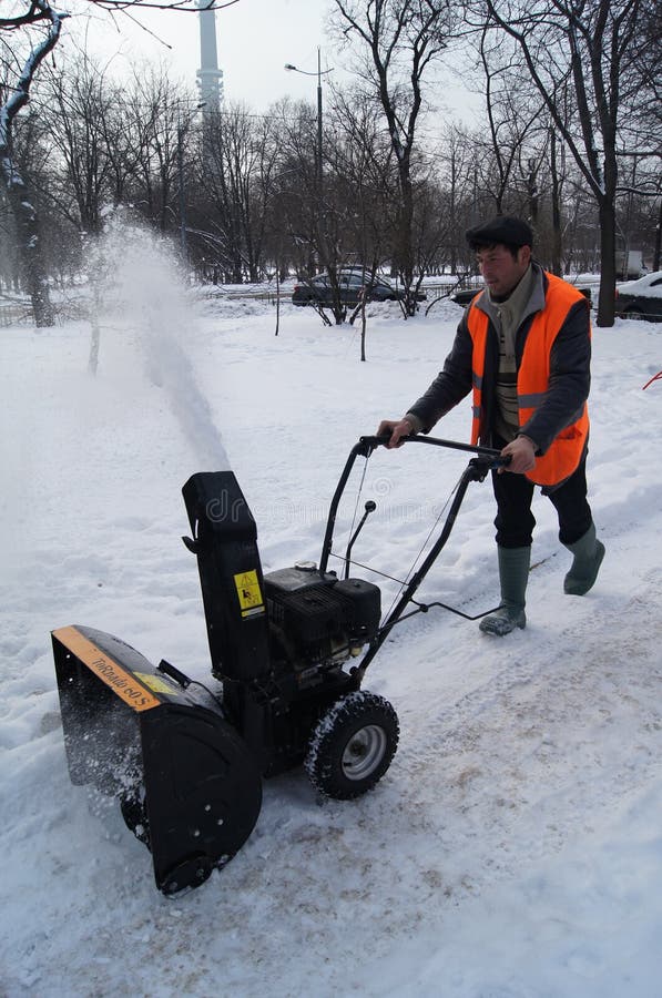Man Using a Snow Blower stock image. Image of thrower - 7375311