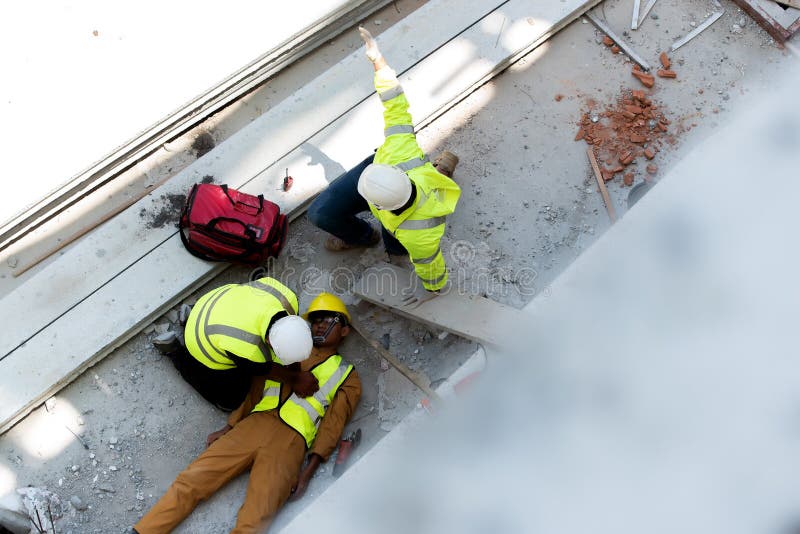 Accident in Industrial Work with First Aid Stock Photo - Image of body ...