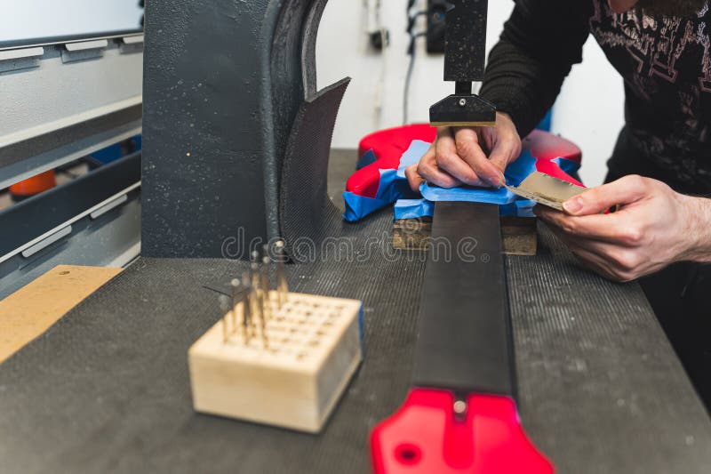Worker Adding Thread and Frets on a Guitar at the Workshop, Guitar ...