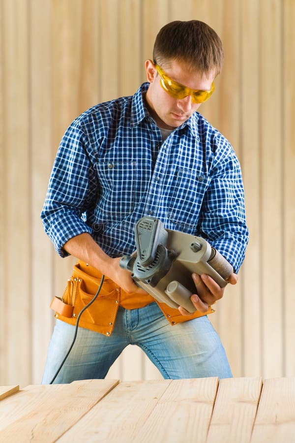 Worker Adjusting Detail Sander Stock Photo - Image of male, contractor ...