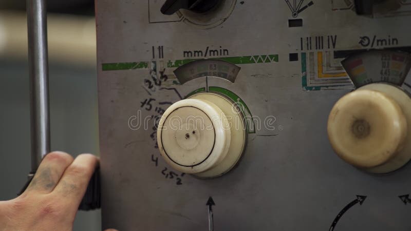 Worker Adjusting Speed and Feed Rate on Industrial Machine Control ...