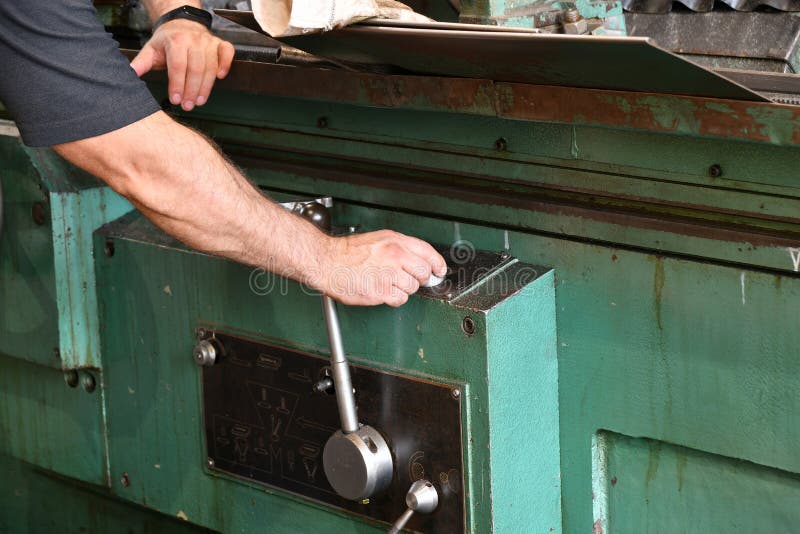 The Worker Adjusts the Working Speed of the Grinding Table of the ...