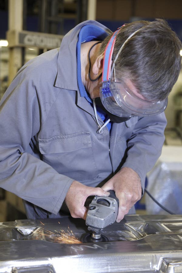 Worker with angle grinder stock photo. Image of working - 14217572