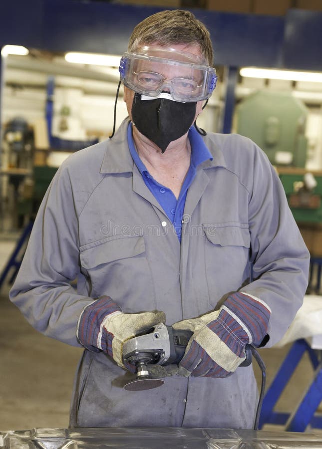 Worker with angle grinder stock image. Image of floor - 14217845