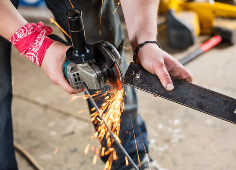 Worker with Angle Grinder for Metal on Workplace Stock Photo - Image of ...