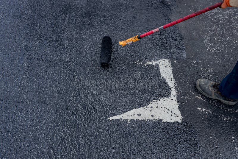 Worker Applies One Phase of Waterproofing with a Roller, the First ...