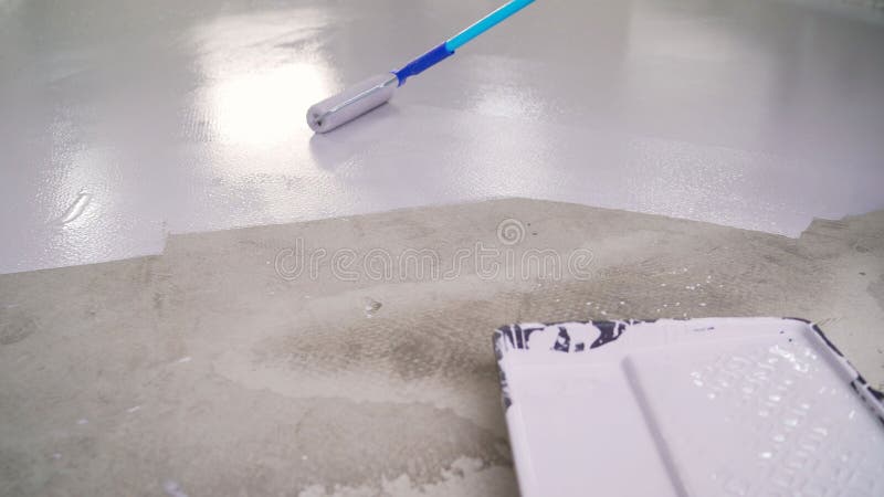 Worker Applying Epoxy Resin on Concrete Floor Stock Photo - Image of ...