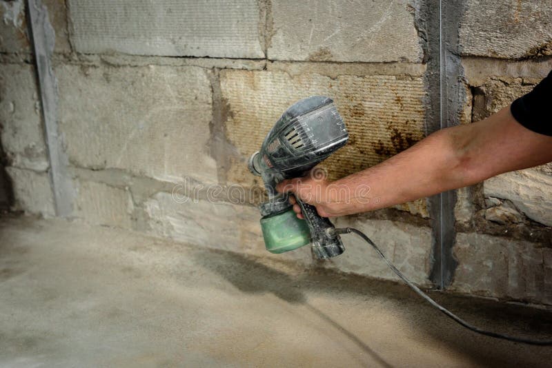 Worker Applying Primer on Prepped Wall, Using Spray Gun Stock Image ...