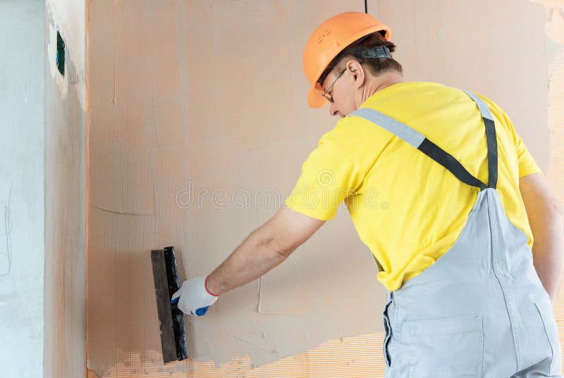 The Construction Worker Putty a Wall Stock Photo - Image of building ...