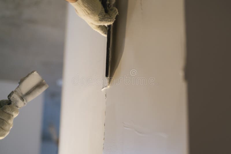 Worker Applying Putty on the Wall with Putty Knife Stock Photo - Image ...